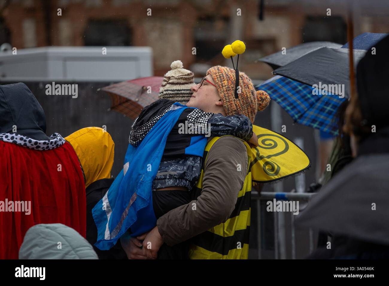 Madrid, Spain. 2nd Mar, 2025. A woman dressed with antennas and a cape ...