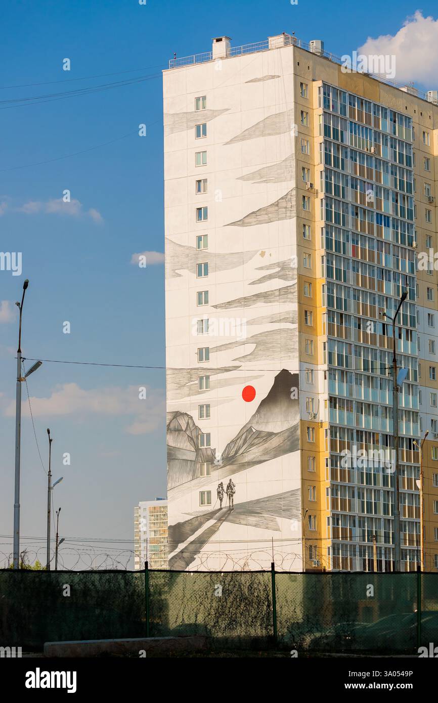 Large mural painting covering the side of an apartment building ...