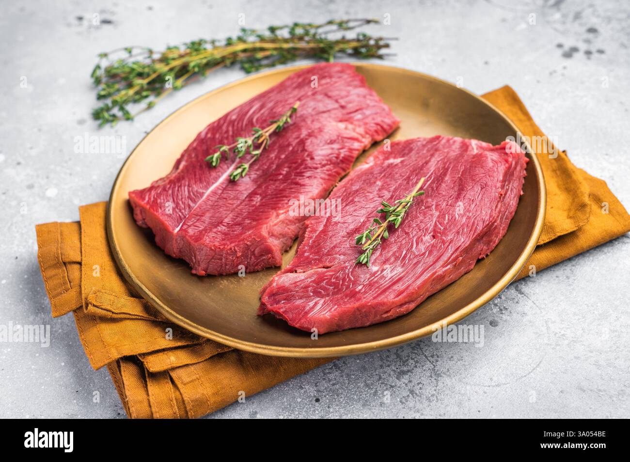 Raw Venison steak, fresh Wild Roe Deer Game Meat. grey background. top ...