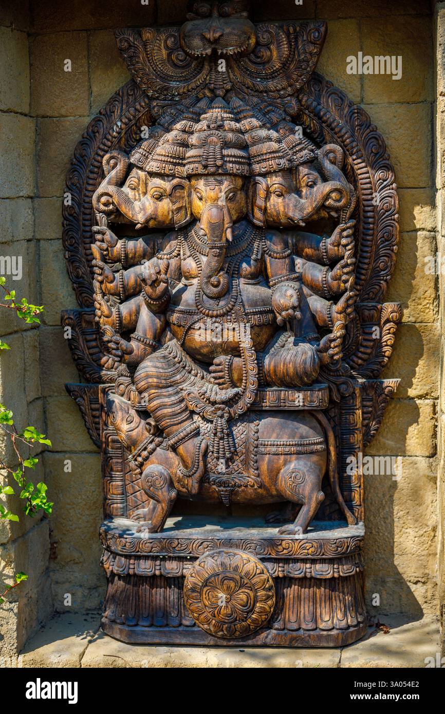 Intricate wooden carving of ganesha, the hindu god of wisdom and ...
