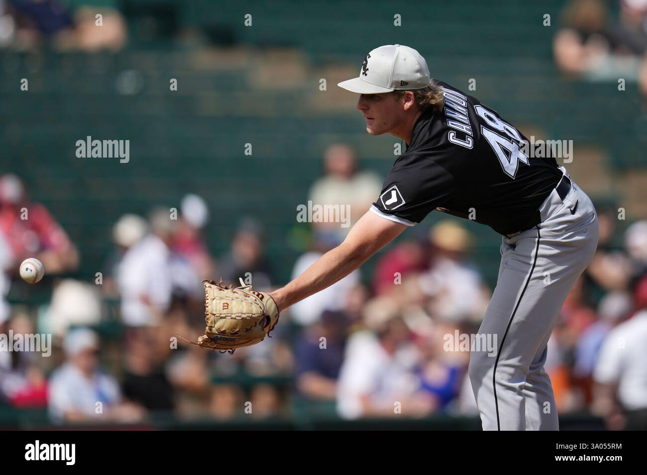 Chicago White Sox pitcher Jonathan Cannon reaches out for the baseball ...