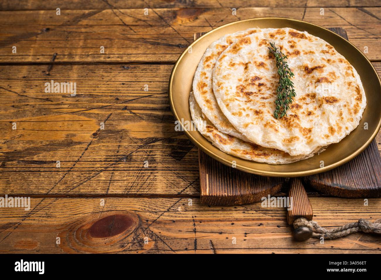 Potato Stuffed Flat Bread Aloo paratha, Traditional Indian food. wooden ...