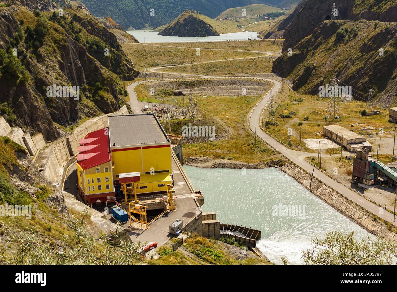 Water flowing through dam powering hydroelectric station in scenic ...