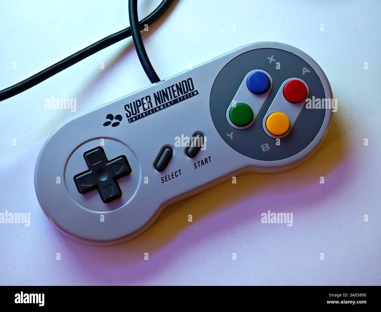 Old retro SNES Super Nintendo game controller pad closeup, vintage gaming hardware, classic ...