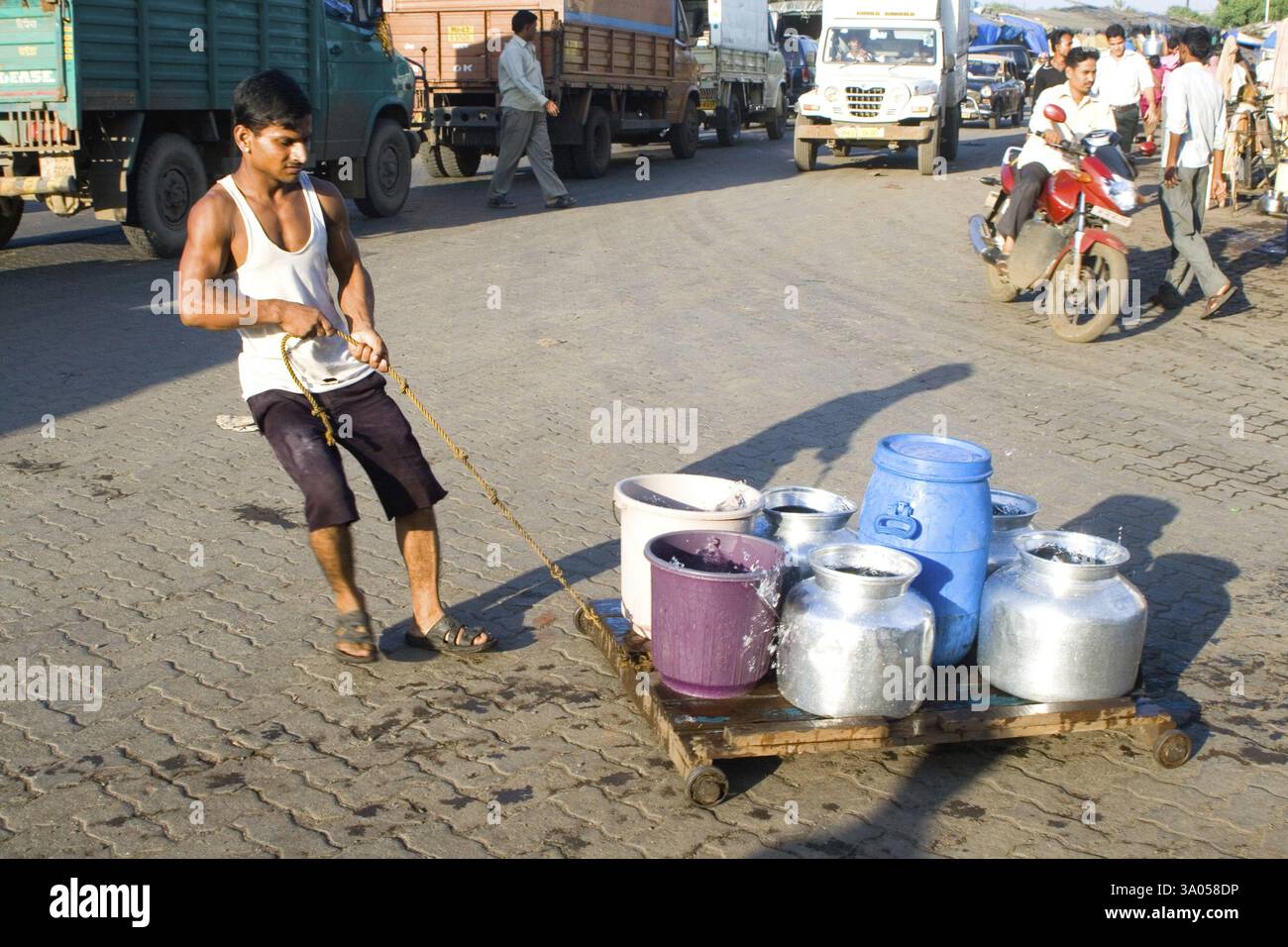 Slum man pulling watercart in reay road, Bombay Mumbai, Maharashtra ...