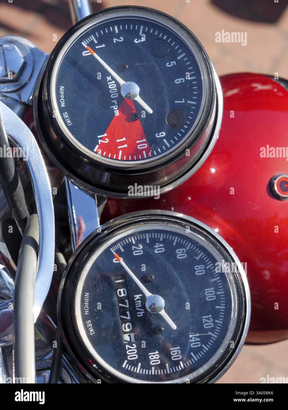 Double measuring instrument with speedometer and rev counter on red ...