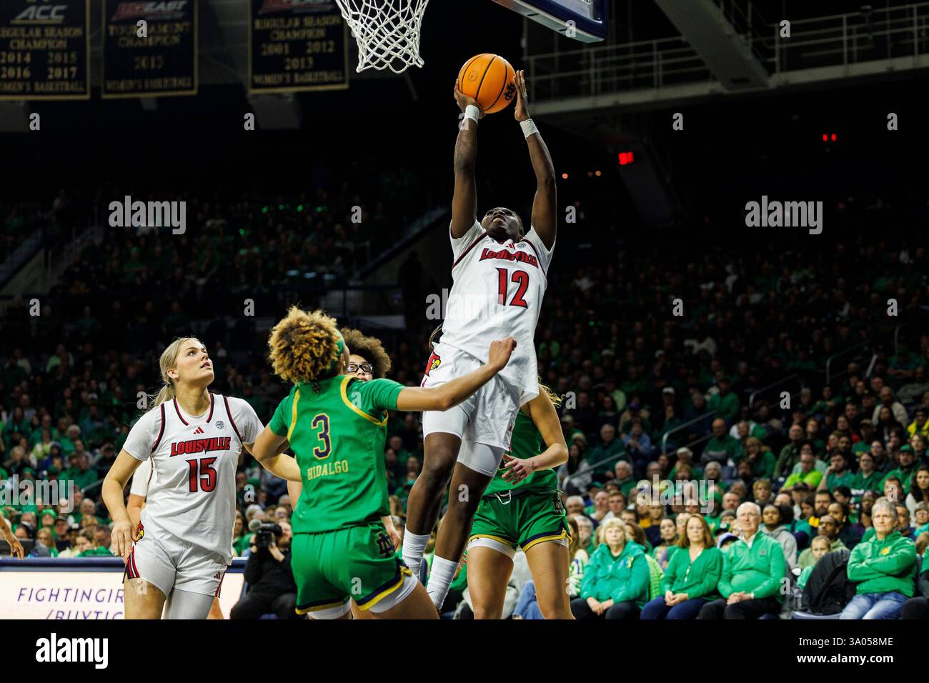 Louisville guard Ja'Leah Williams (12) shoots over Notre Dame guard ...