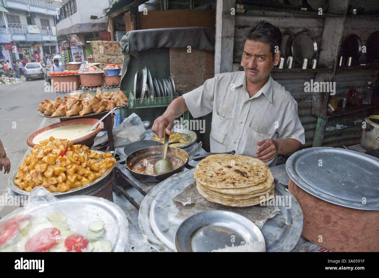 Man making food on road side uttarakhand India Asia Stock Photo - Alamy