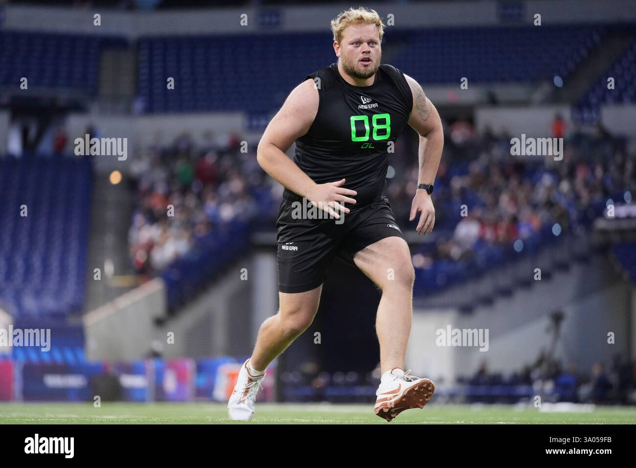 Texas offensive lineman Hayden Conner runs a drill at the NFL football ...