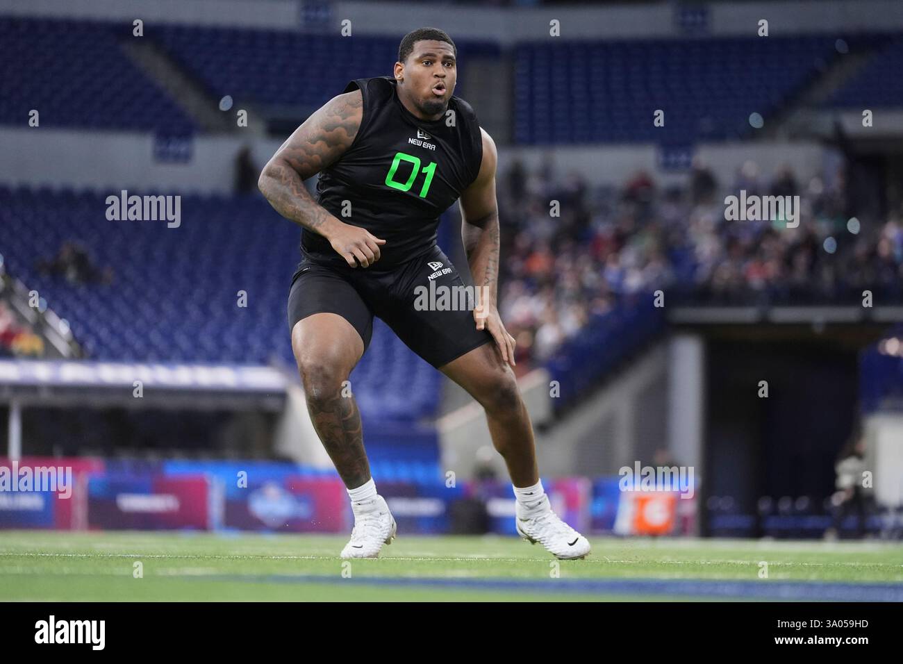 Texas offensive lineman Kelvin Banks Jr. runs a drill at the NFL ...