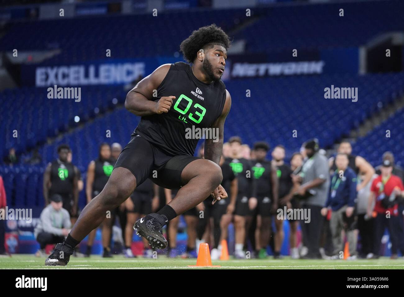 Alabama offensive lineman Tyler Booker runs a drill at the NFL football ...