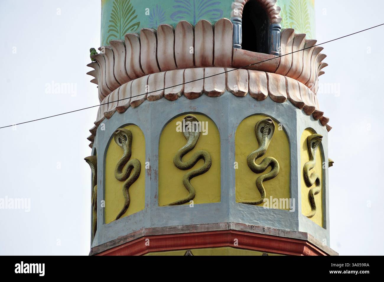 Relief sculptures of cobra snakes on shaking tower, jagdamba temple ...