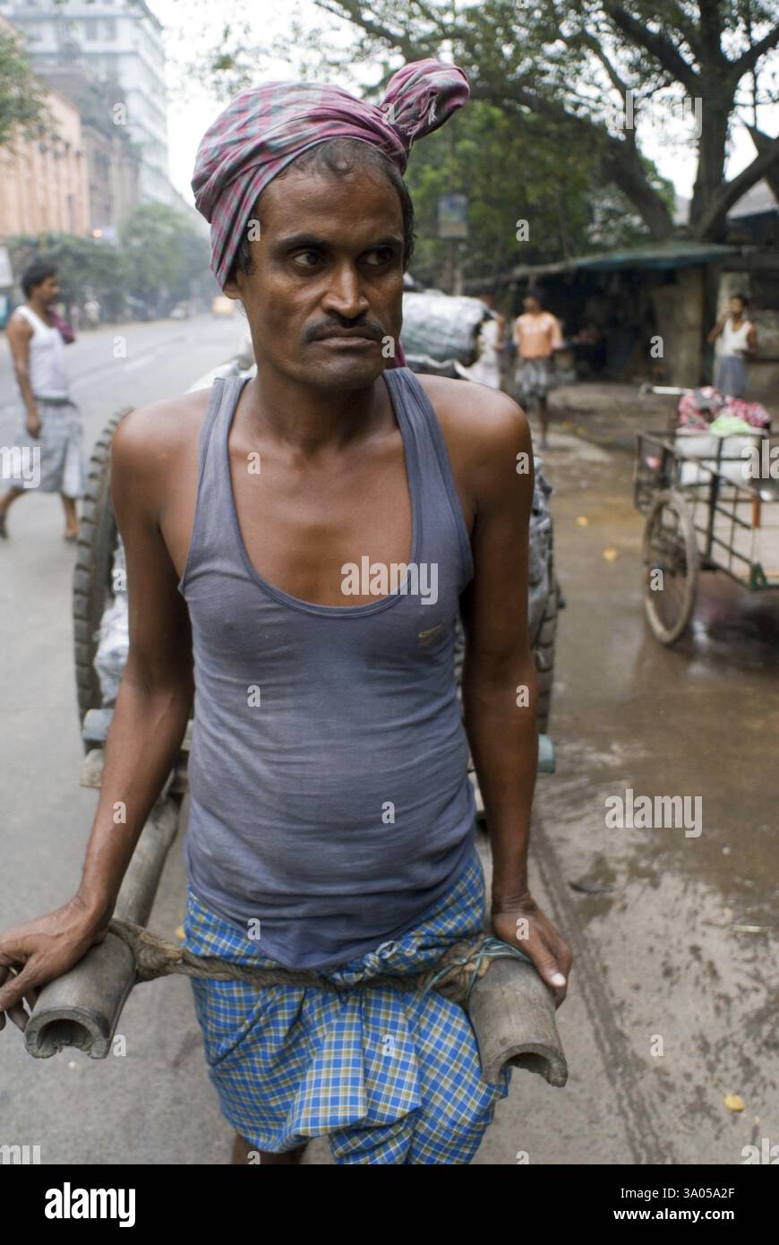 Handcart Puller pulling heavy Cart on street, Kolkata, West Bengal ...