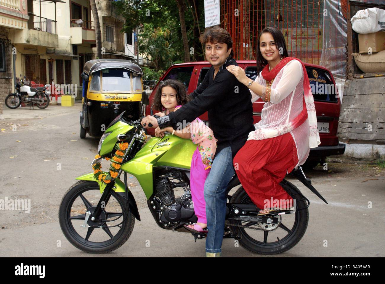Indian family riding new motorcycle, Mumbai, Maharashtra, India, Asia ...