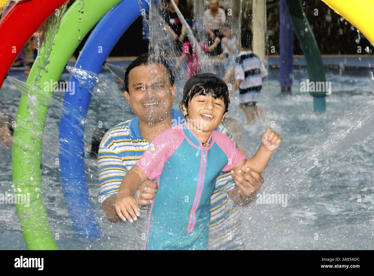 Father enjoying shower bath with son in swimming pool MR#364 Stock ...