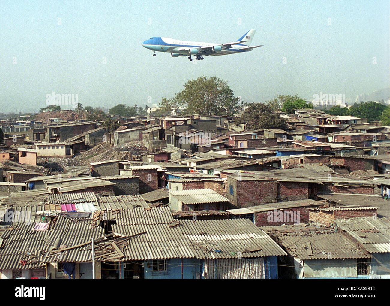 Air force one, official carrier American President flying over slums ...