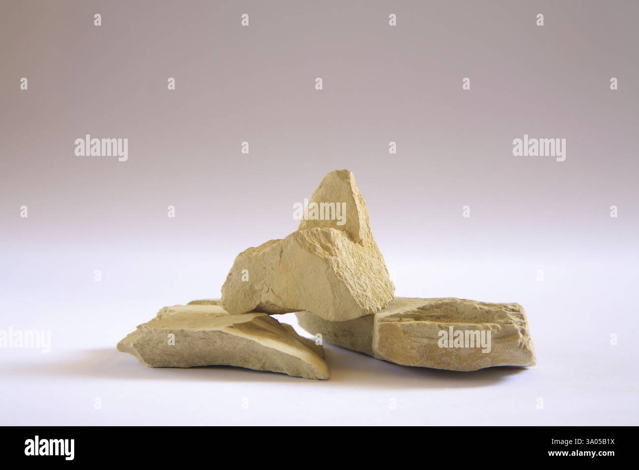 Herbal multani mitti stone on white background Stock Photo - Alamy