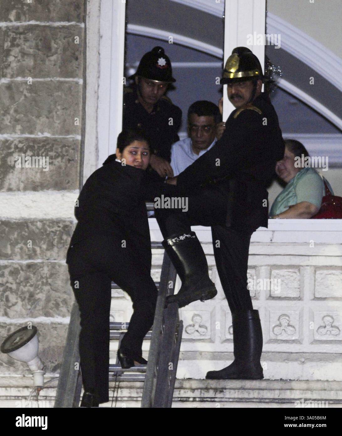 Fire Brigade officer ladder rescue hostages window of Taj Mahal Hotel ...