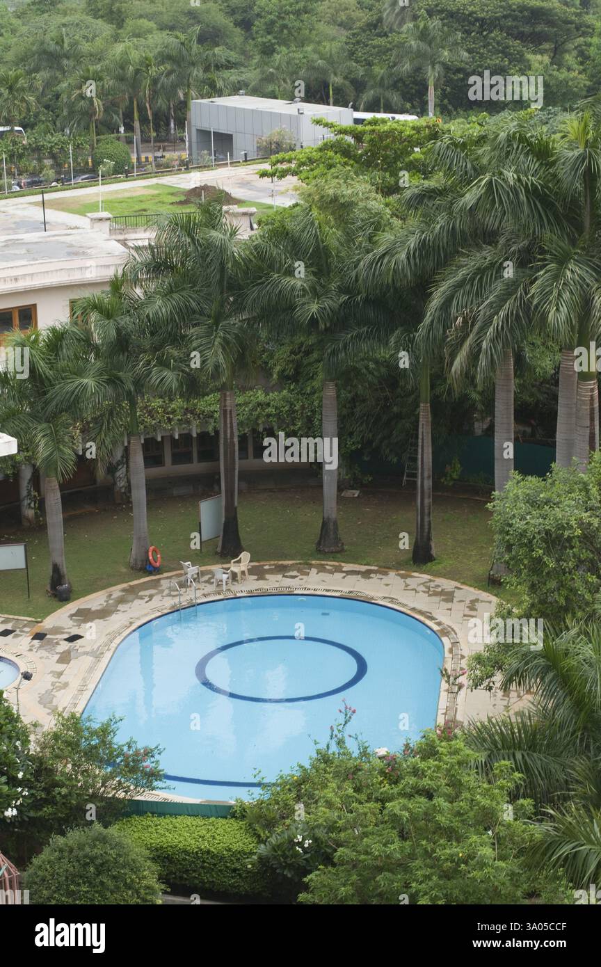 Swimming pool with trees Pune Maharashtra India Asia June 2011 Stock ...