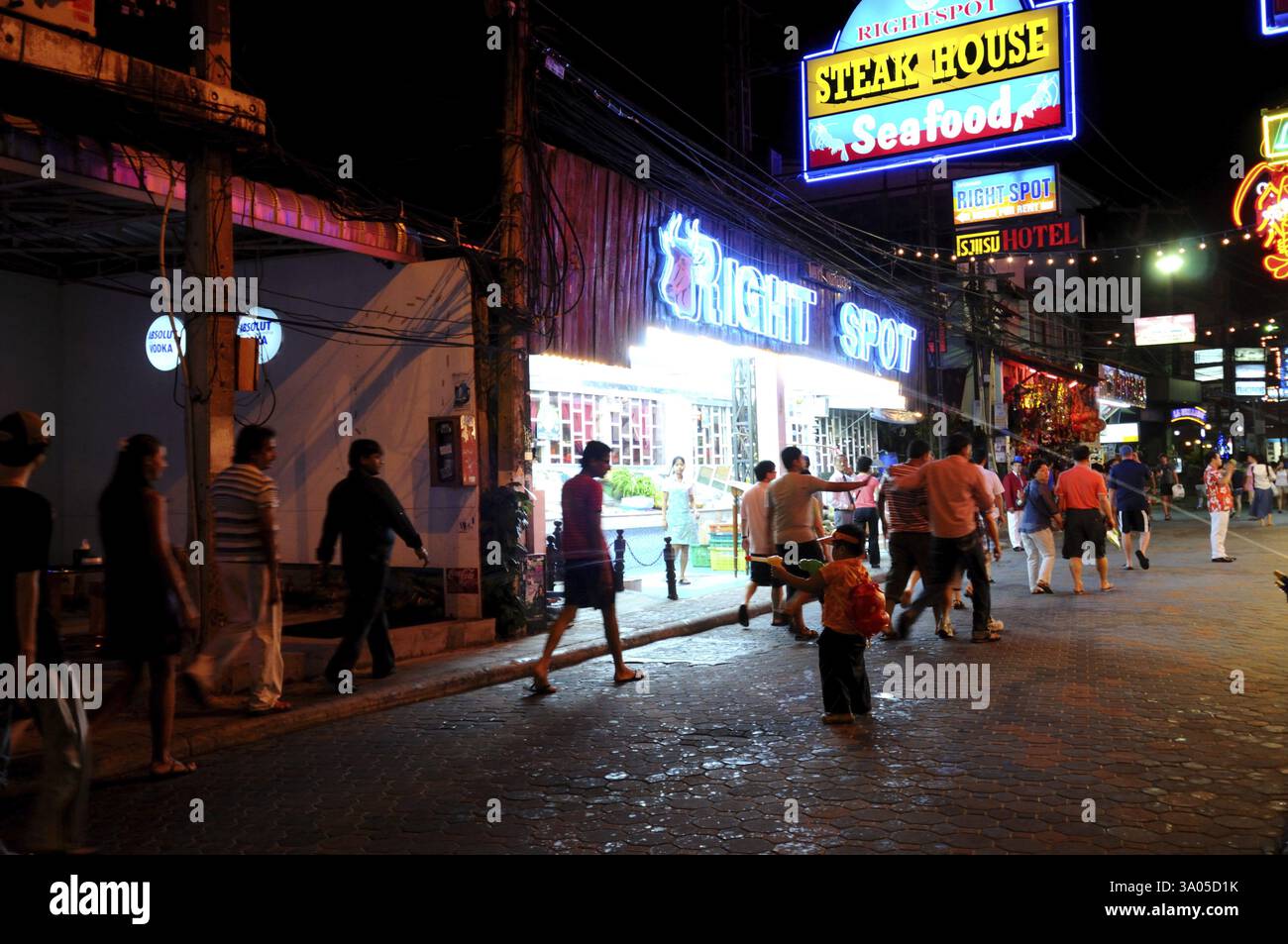 Night life and neon signs of restaurants and nightclubs at Walking ...
