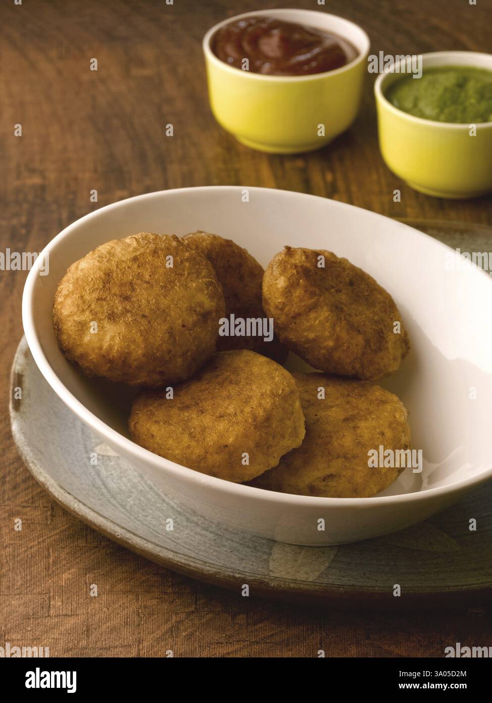 Snack, aloo tikki in bowl Stock Photo - Alamy