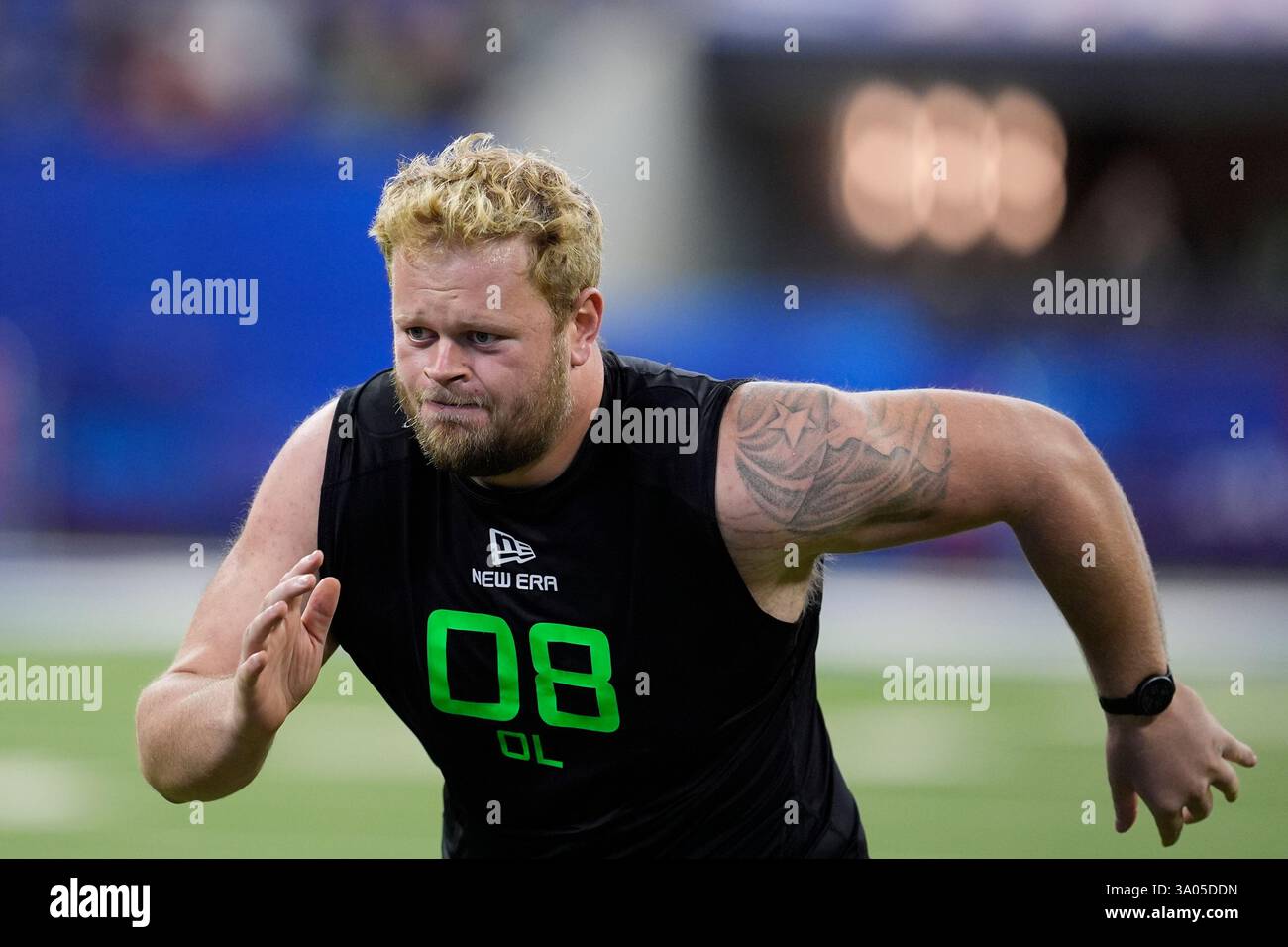 Texas offensive lineman Hayden Conner runs a drill at the NFL football ...