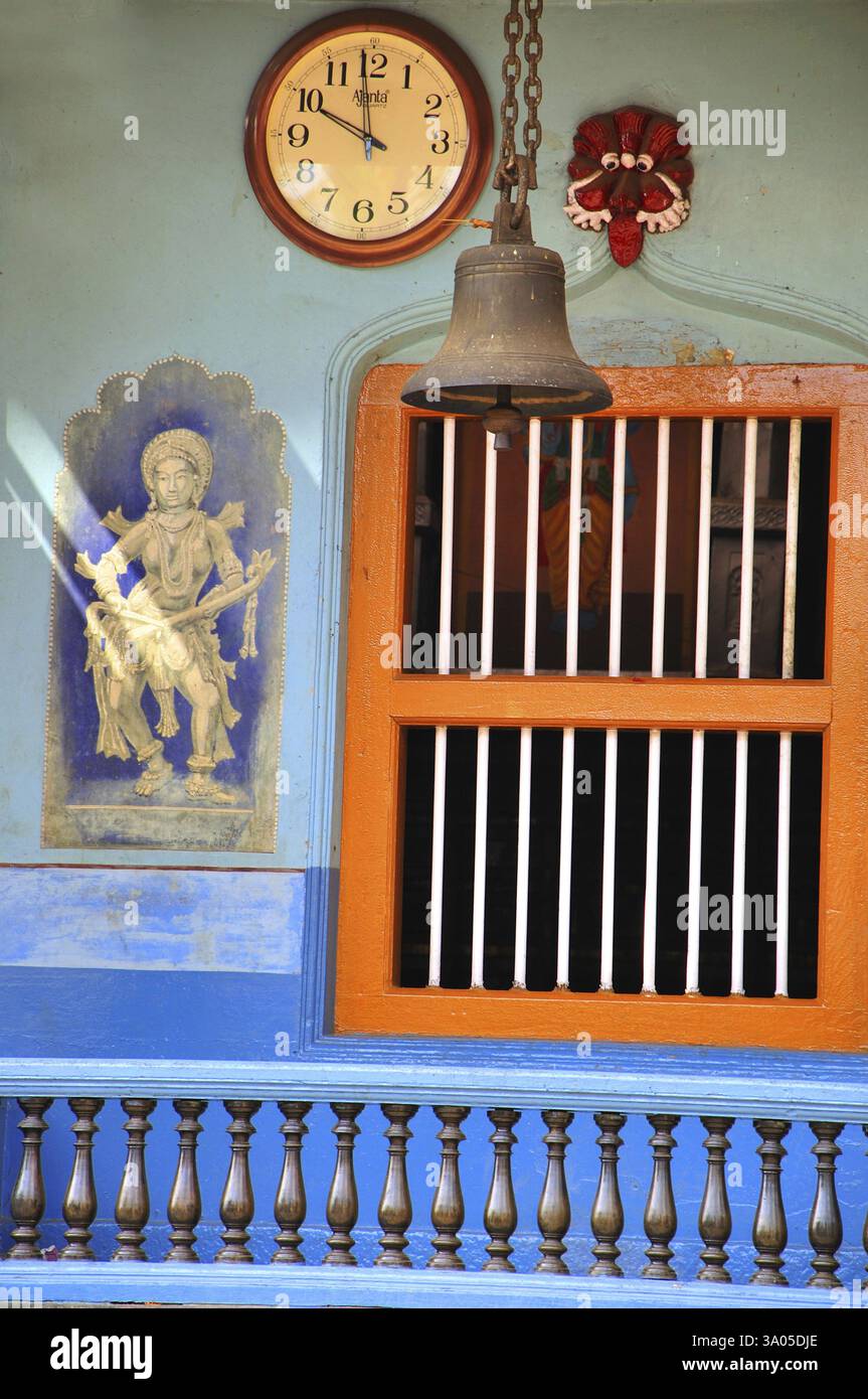 Wooden railing with window wall painting with brass bell and watch in ...