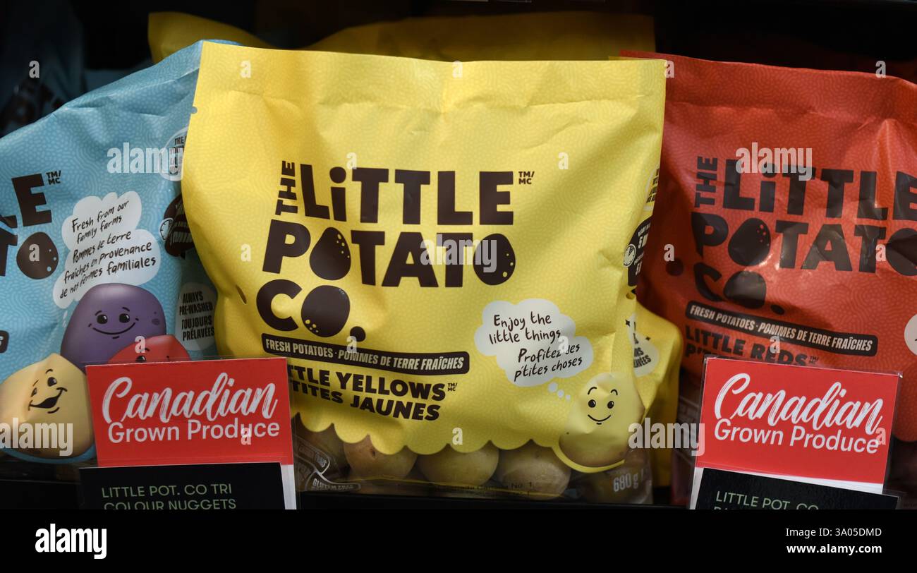 A sign identifies that potatoes are Canadian grown produce at a grocery ...