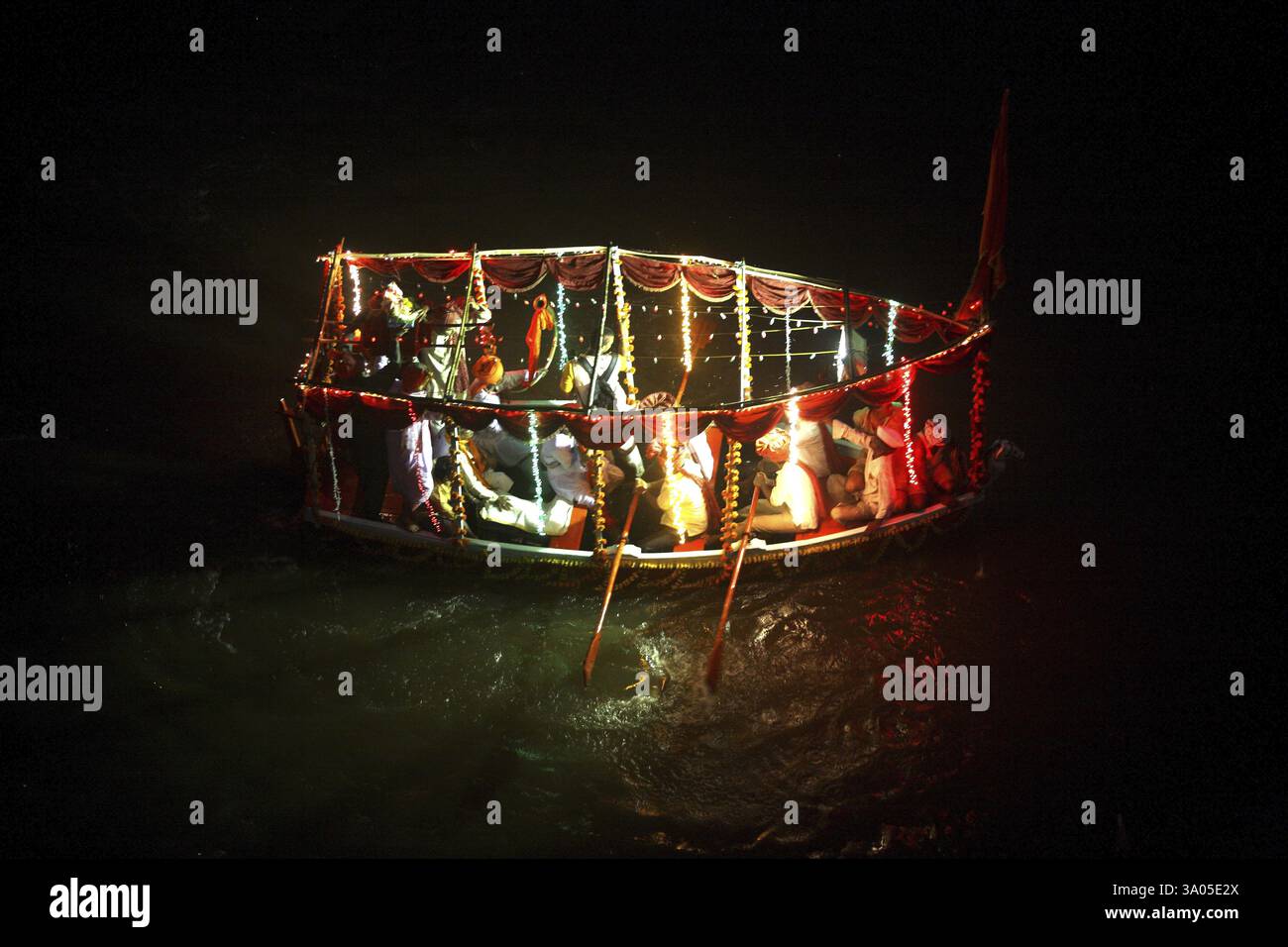 Small royal boat decorated with flowers and lights for immersion of ...