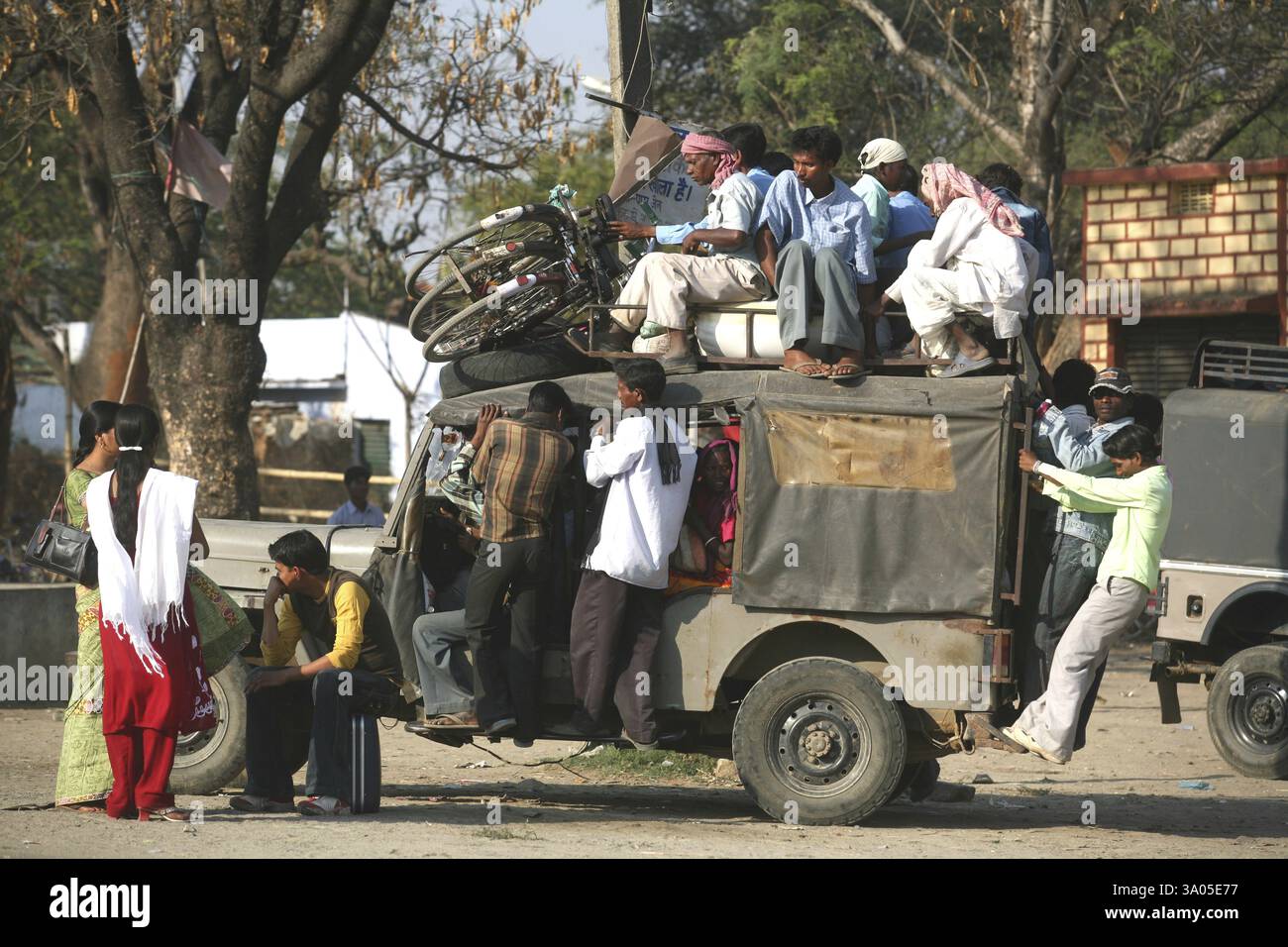 Passengers mounted on top of jeep used local transport system in ...