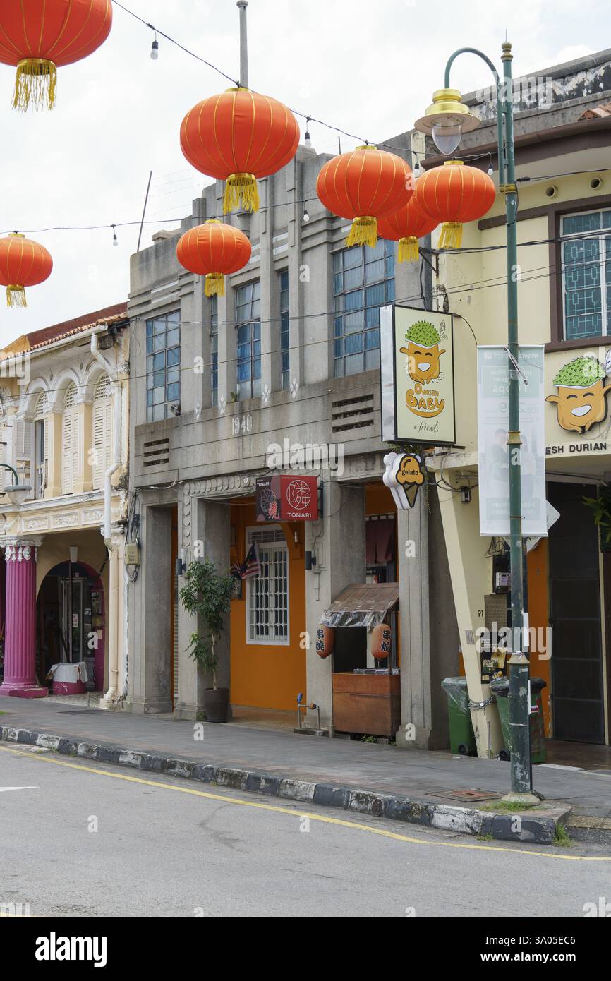 Colourful street scene with lanterns and traditional buildings in a ...