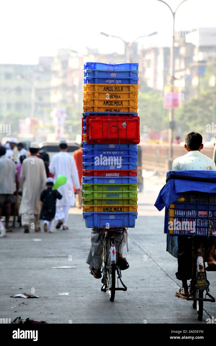Plastic tubs used by milk-suppliers to distribute milk being taken on ...