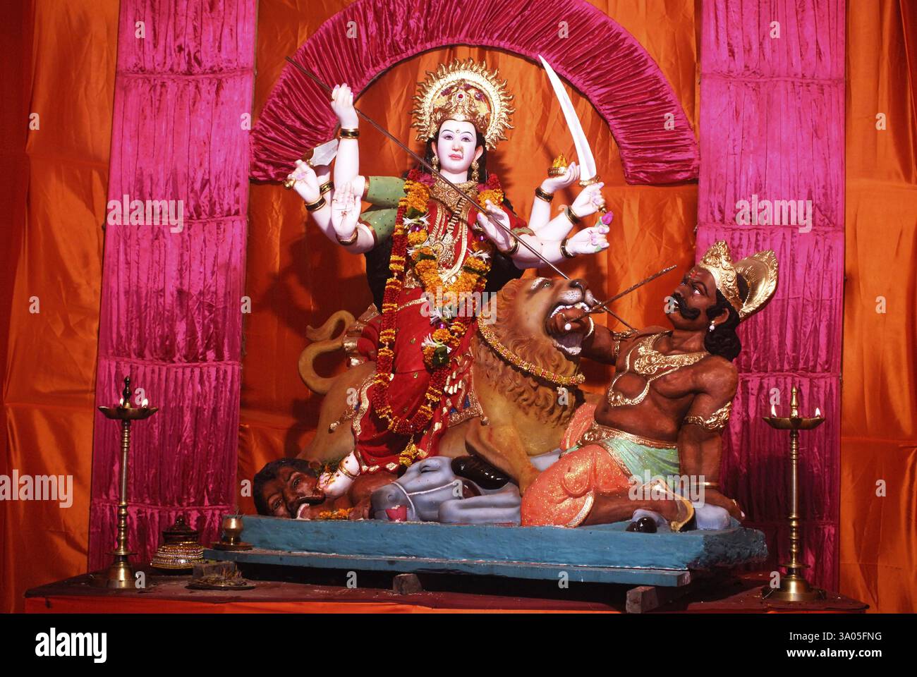 Idol of goddess Durga riding on lion killing demon Mahishasura ...