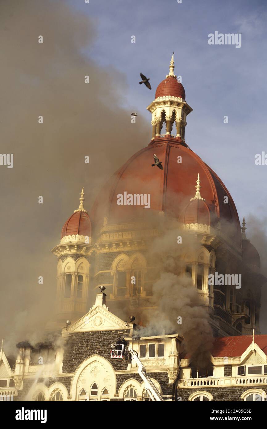 Smoke emits from Taj Mahal Hotel during terrorist attack by Deccan ...