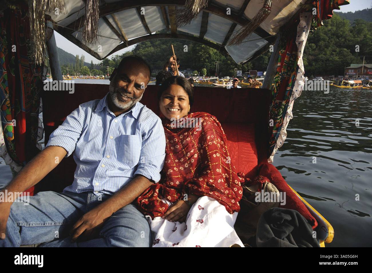 Sudharak Olwe with wife in shikara, Jammu and Kashmir, India MR#400 ...