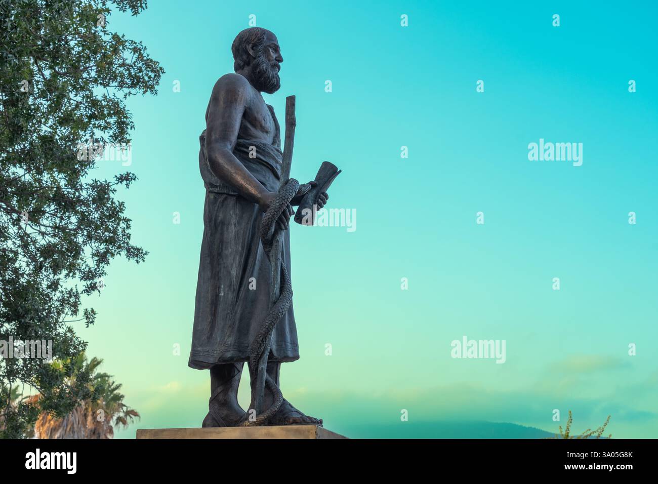 Statue of Hippocrates legendary father of medicine standing side on ...