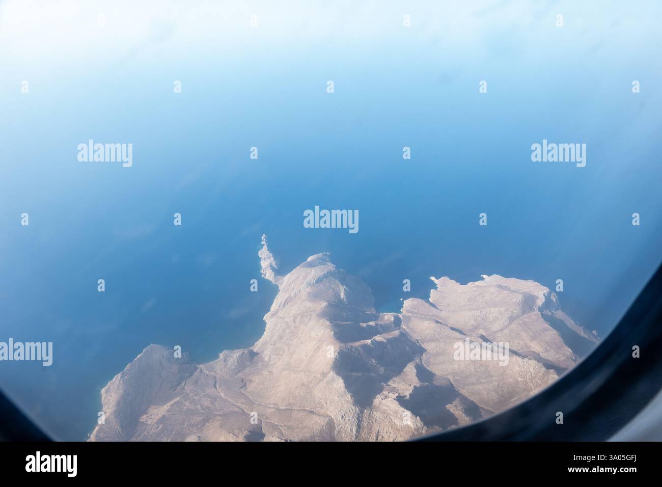 Aerial image below through plane window of Greek Island in ...