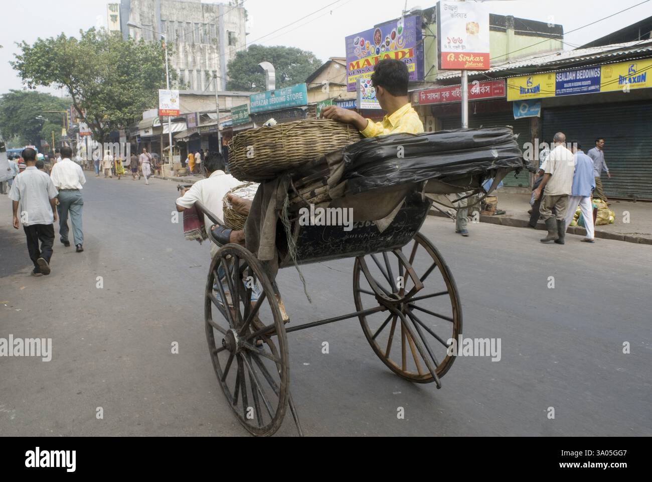 Hand Rickshaw Puller pulling with Passenger, Kolkata, West Bengal ...