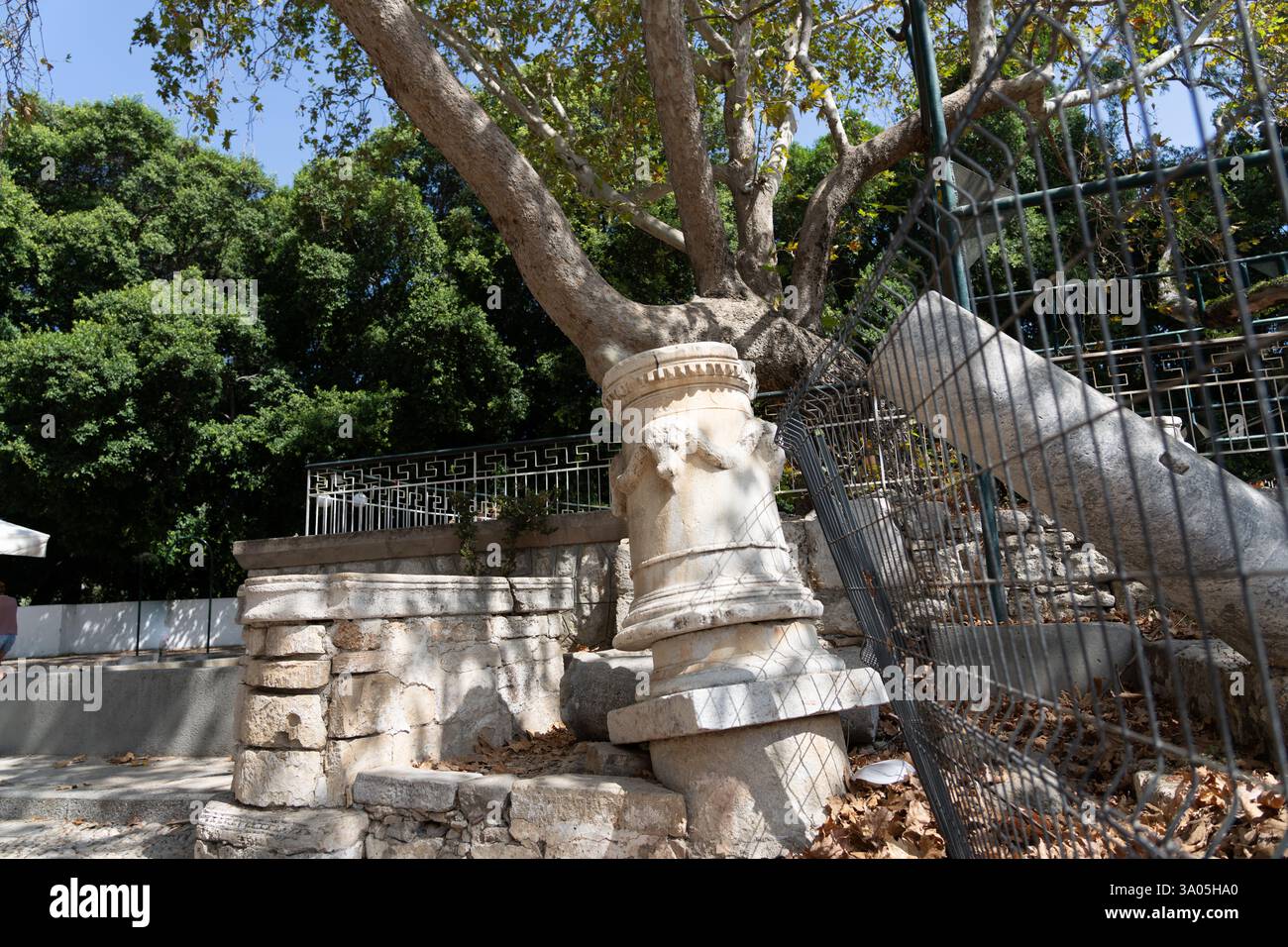 Historic ruins and remains of stone pillar and low wall under famous ...