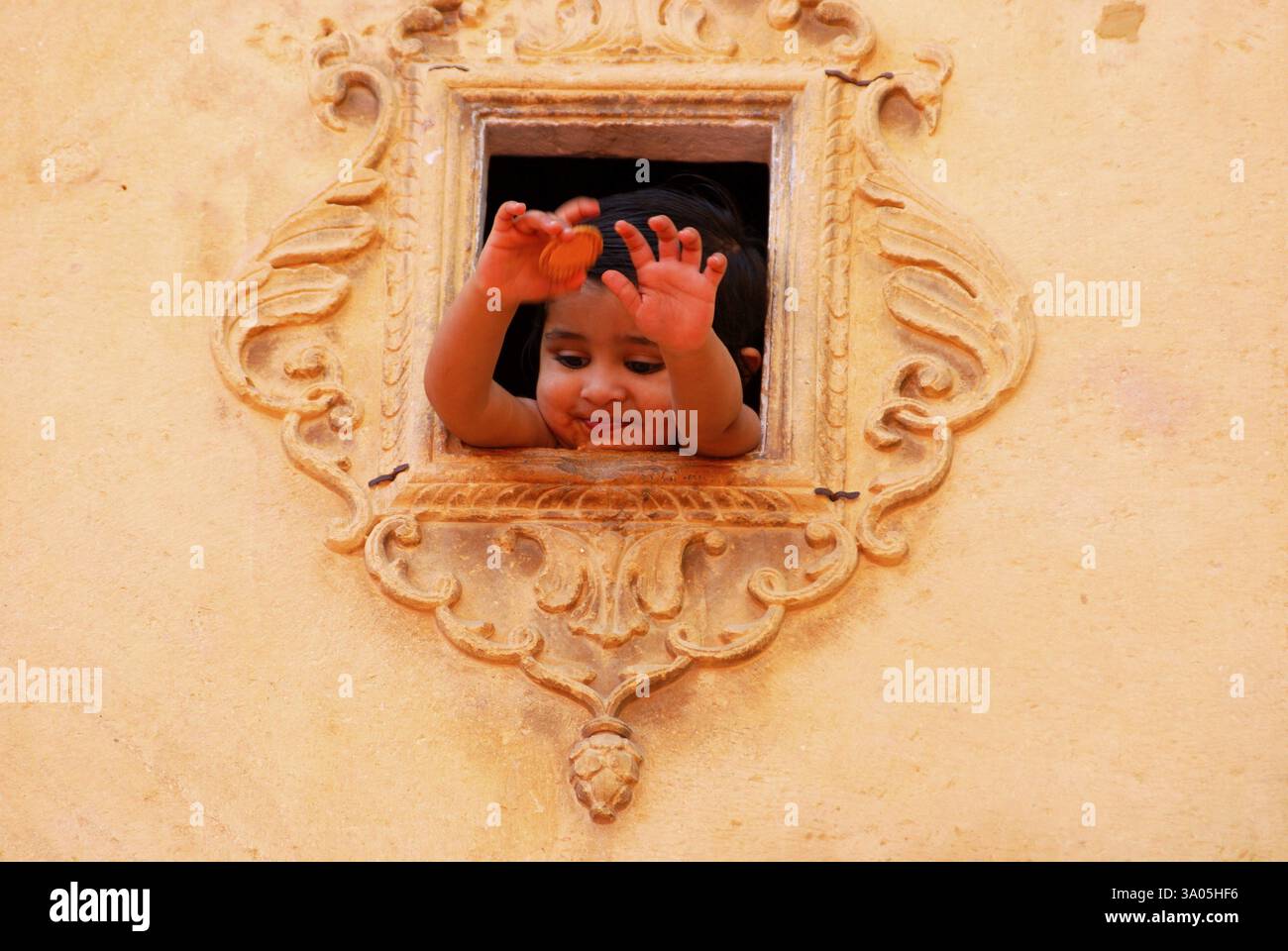 Kid peeping through window, Jodhpur, Rajasthan, India NO MR Stock Photo - Alamy