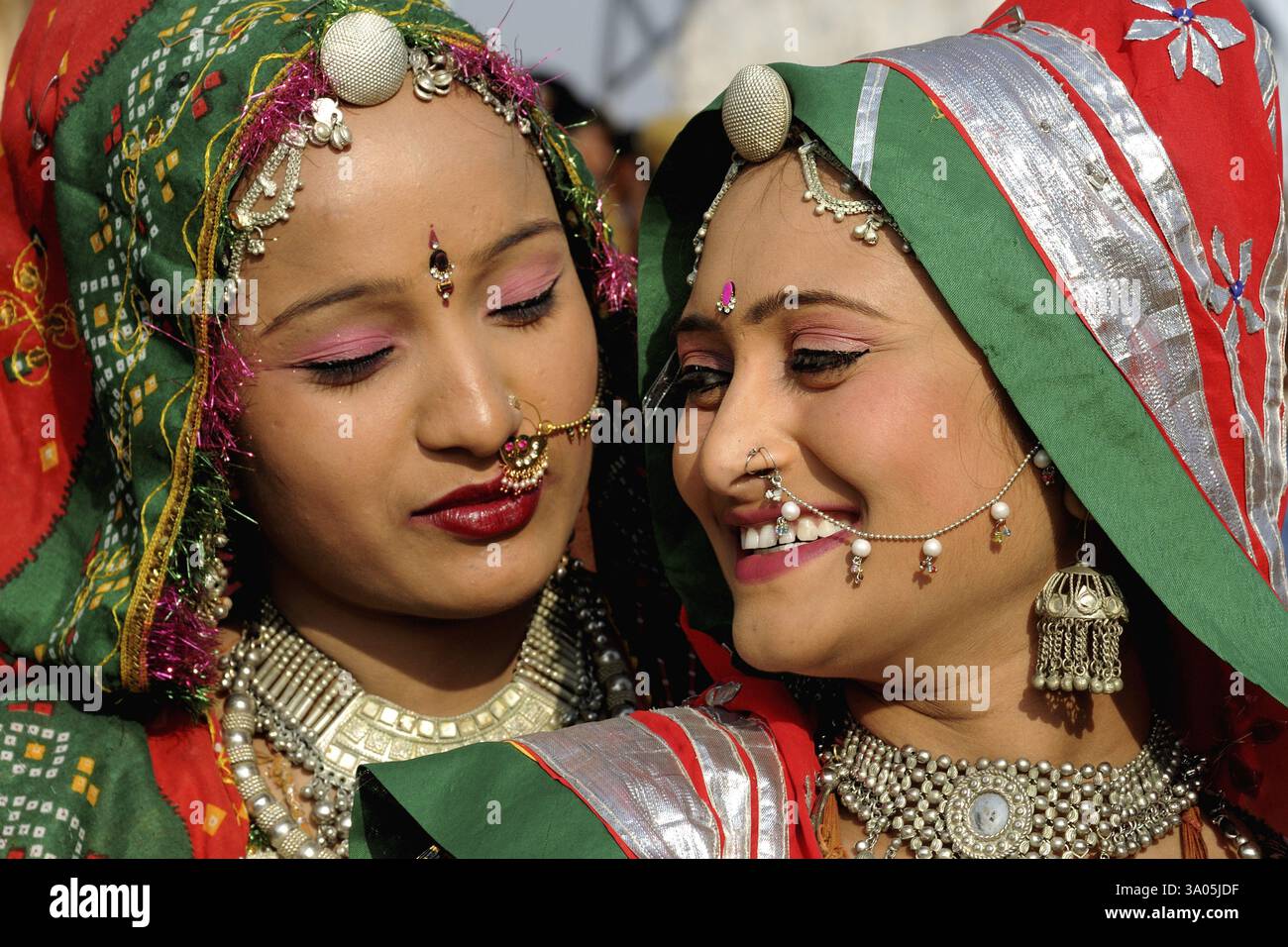 Girls in traditional jewellery and rajasthani costume having chat with ...