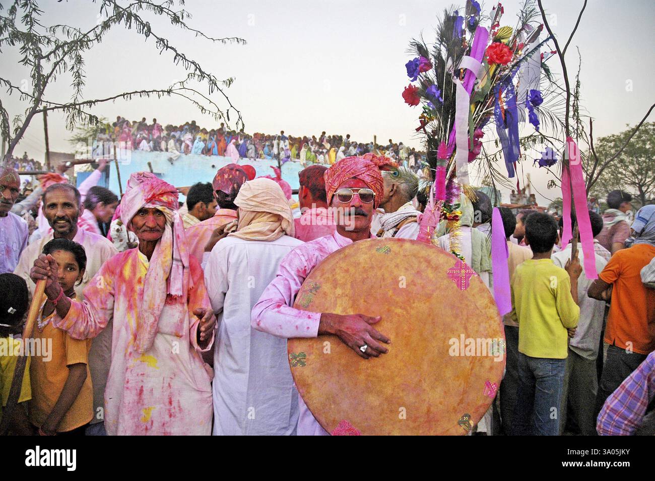 Indian devotees singing and dancing during Holi celebrations in village ...