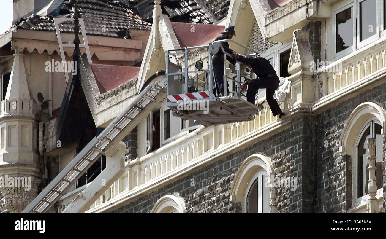 Fire Brigade person rescuing foreign tourist at Taj Mahal hotel after ...