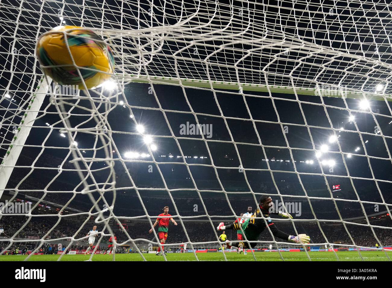 AC Milan's goalkeeper Mike Maignan fails to make a save during the ...