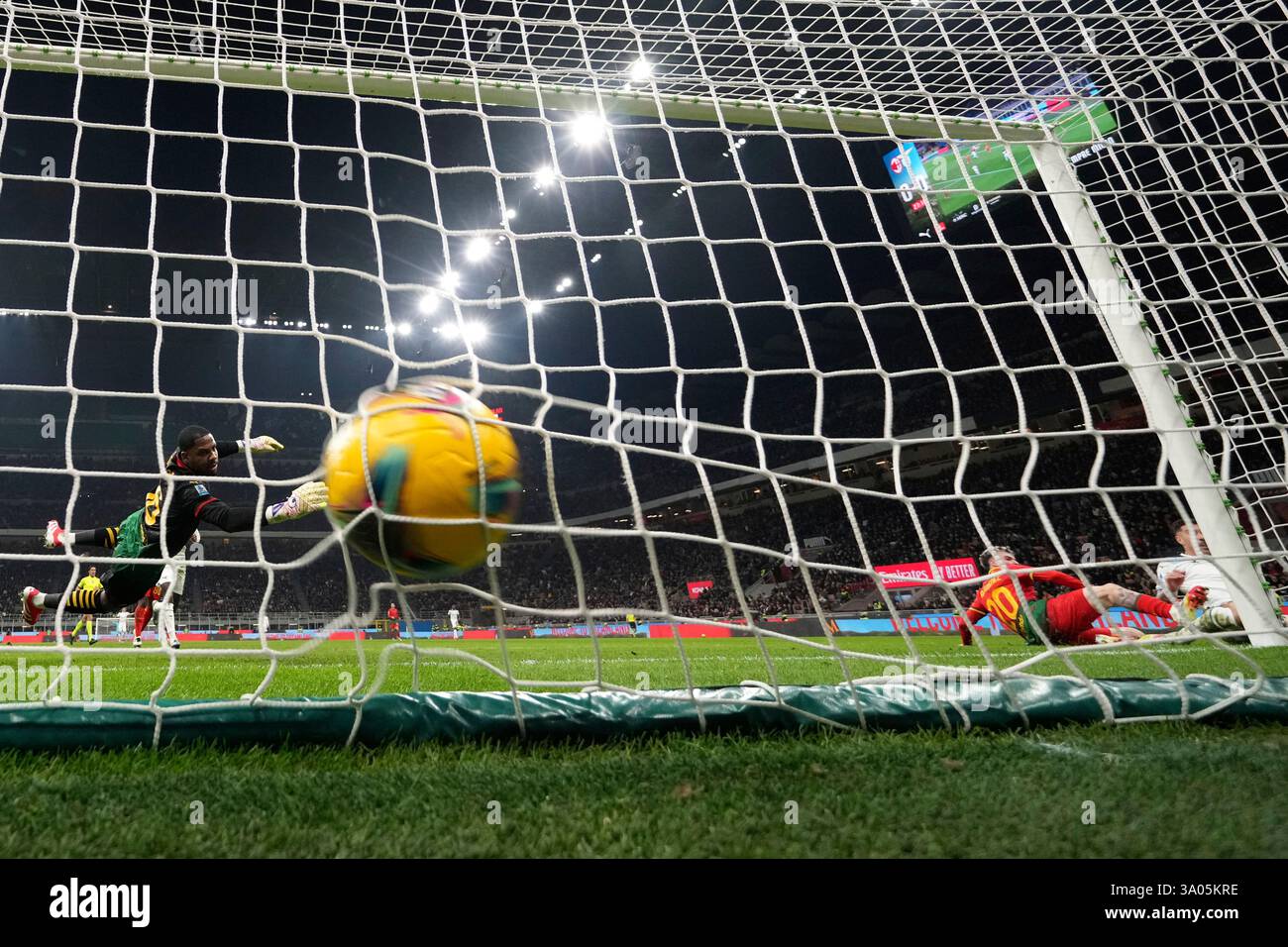 AC Milan's goalkeeper Mike Maignan, left, fails to make a save during ...