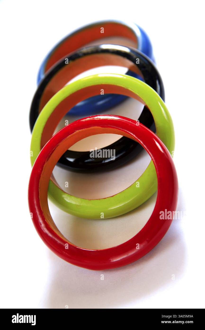 Colourful wooden bangles on white background Stock Photo - Alamy