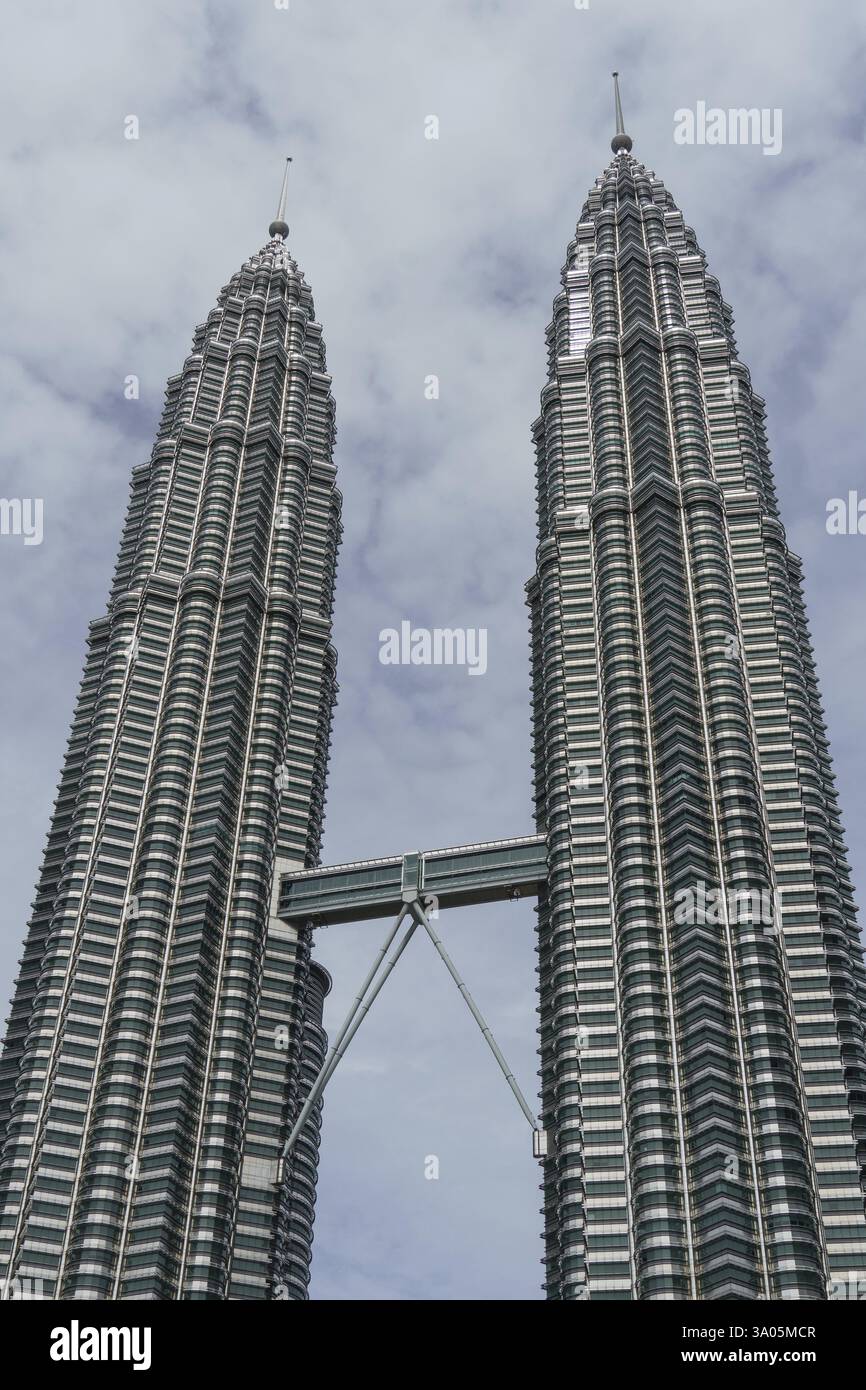 Two striking twin towers under a cloudy sky, modern and majestic, kuala ...