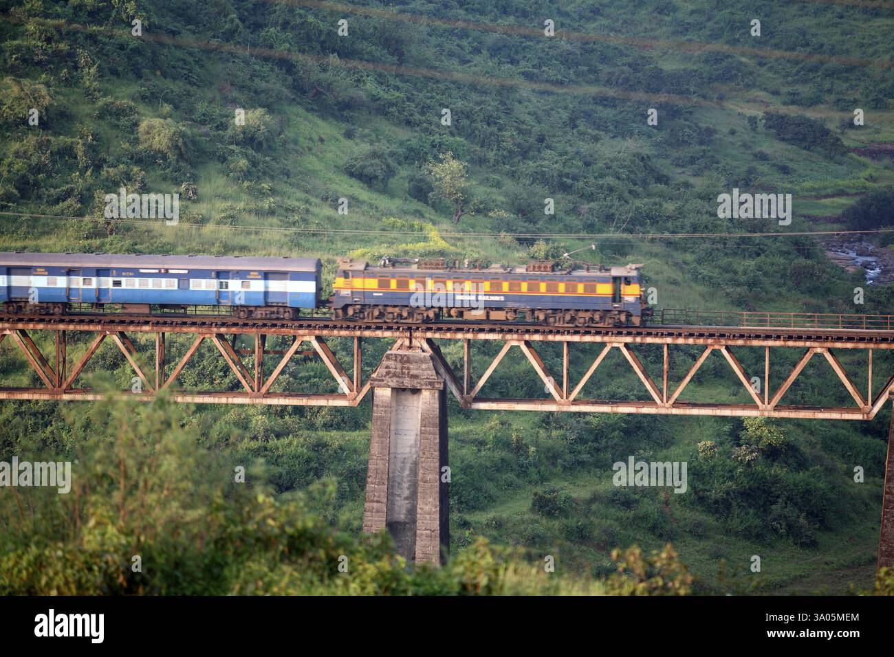 Indian Railways train passing by heightened up bridge at Igatpuri near ...