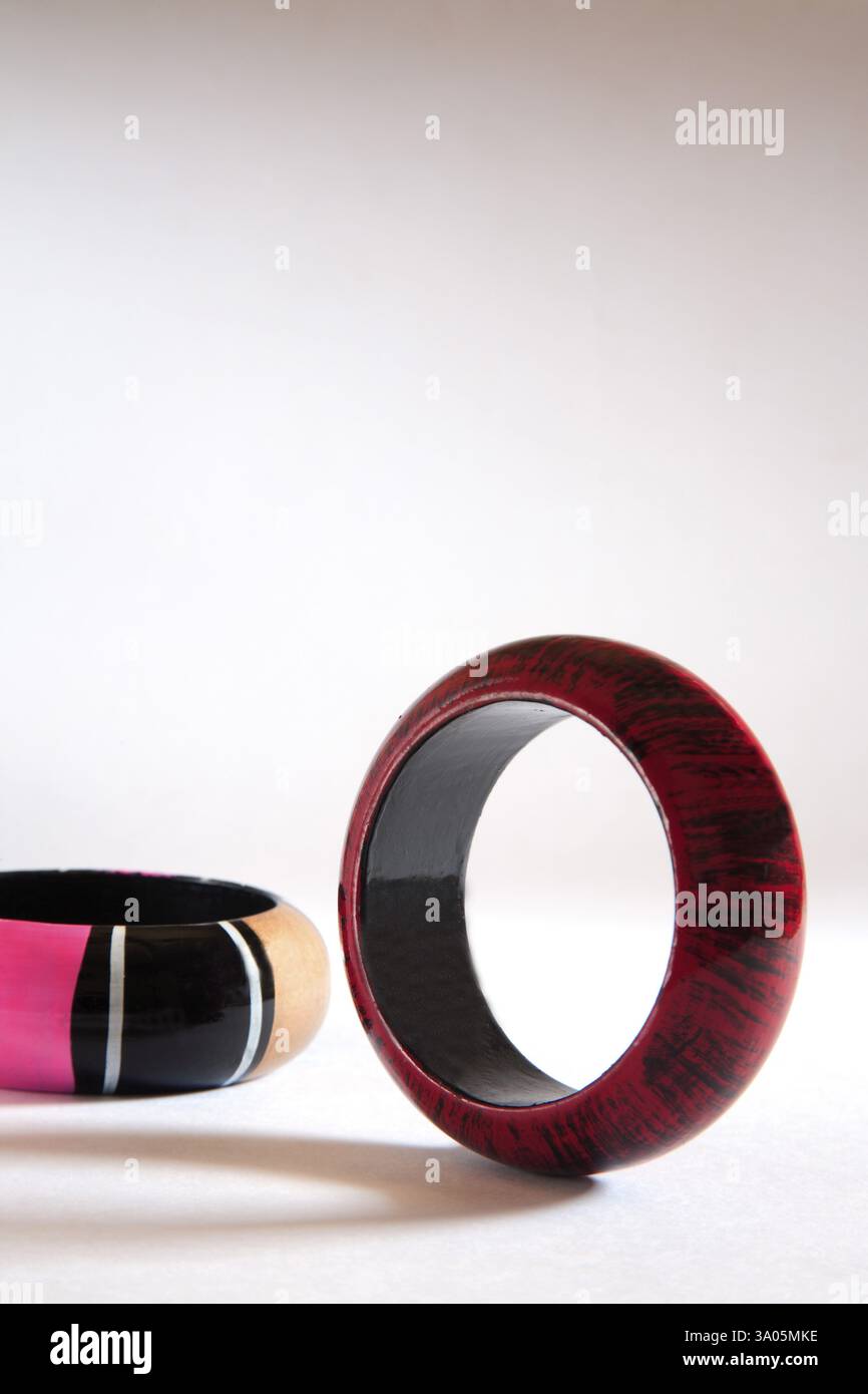Colourful wooden bangles on white background Stock Photo - Alamy