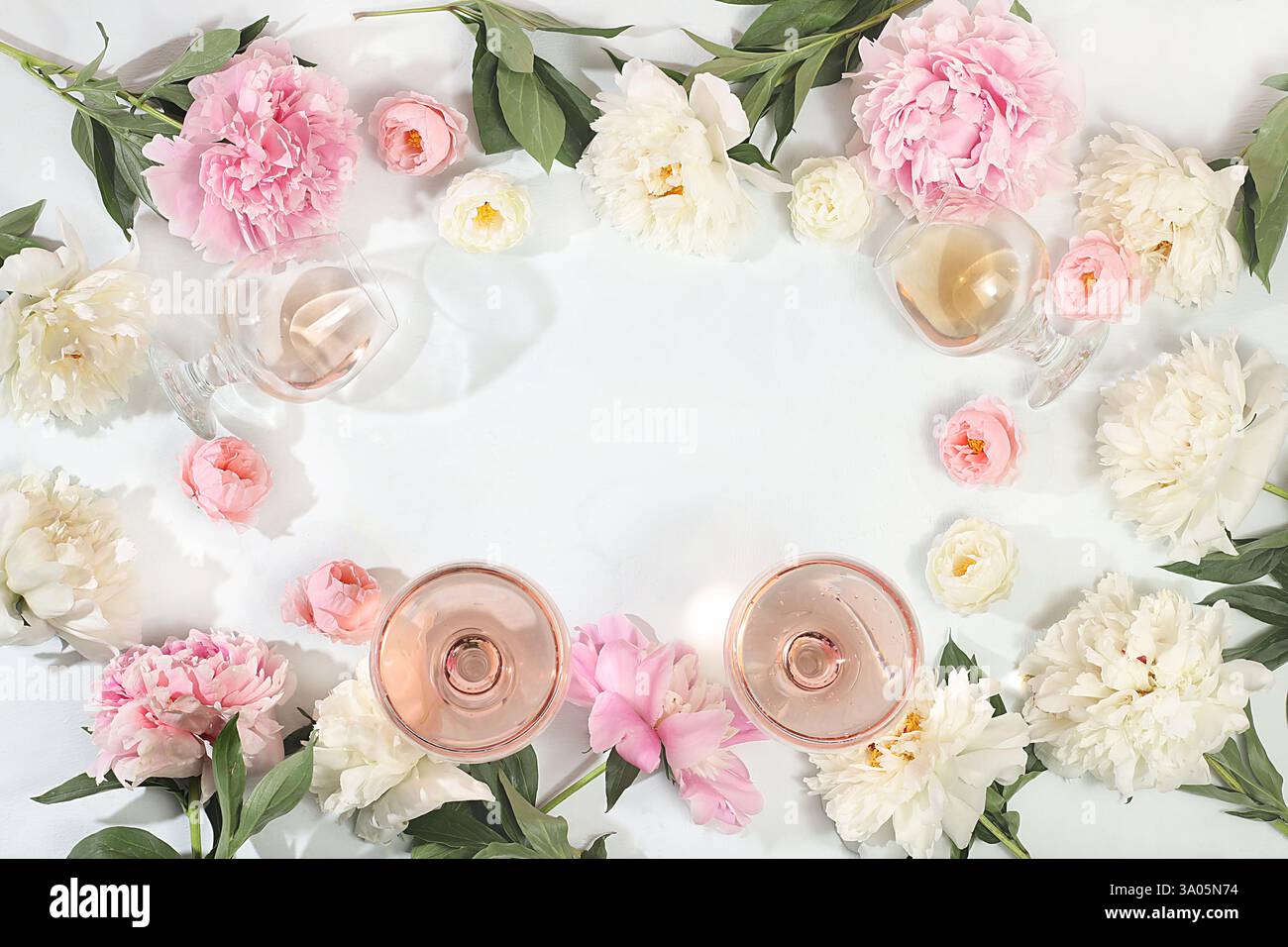 Still life with different types of rose wine, summer alcoholic cocktail for a party and peony ...